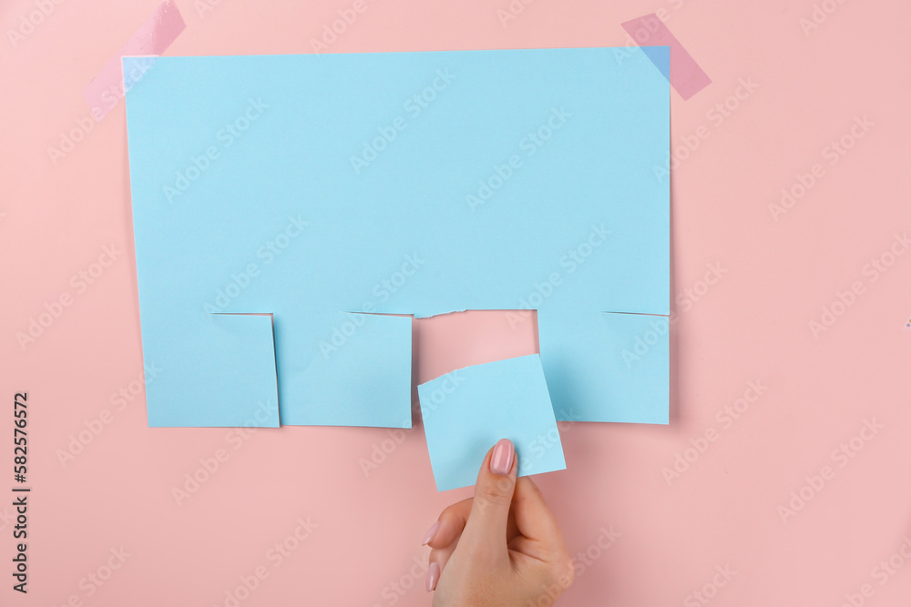 Woman tearing off paper ad on pink background Stock Photo | Adobe Stock