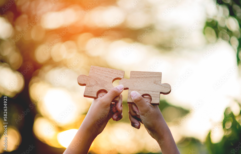 Team work, hands and jig Saw Unite with power Is a good team of ...