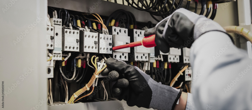 Electricity and electrical maintenance service, Engineer hand holding ...