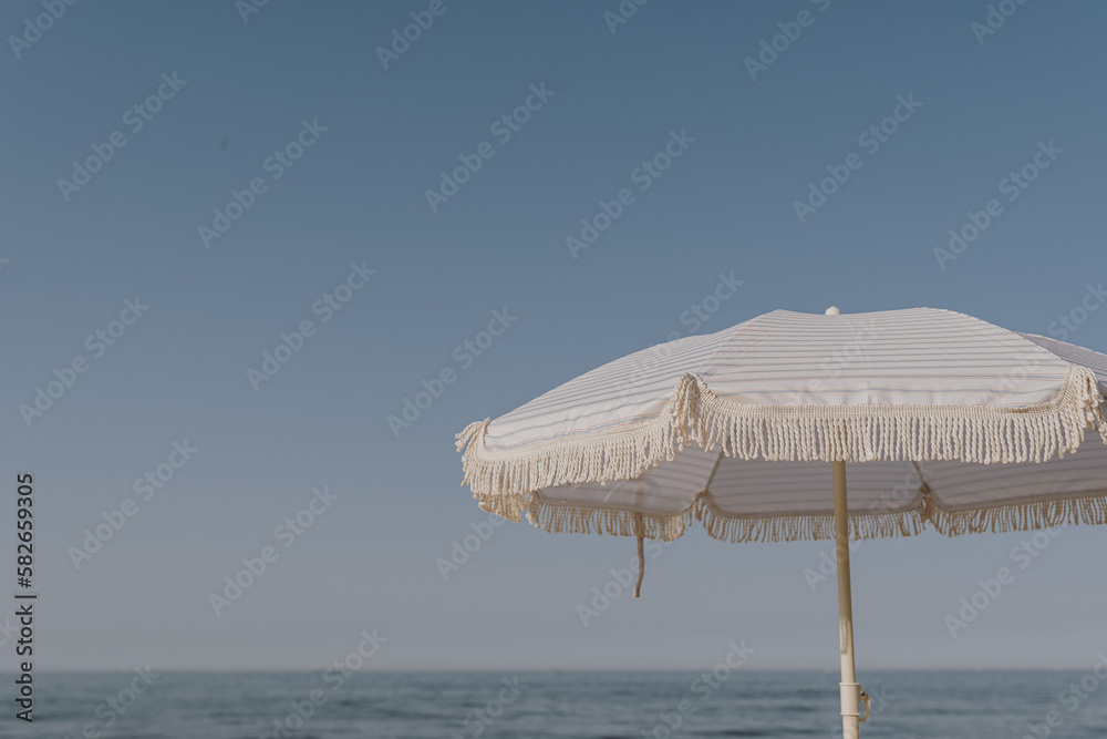 Minimal summer holidays vacation concept. Beach umbrella in front of ...