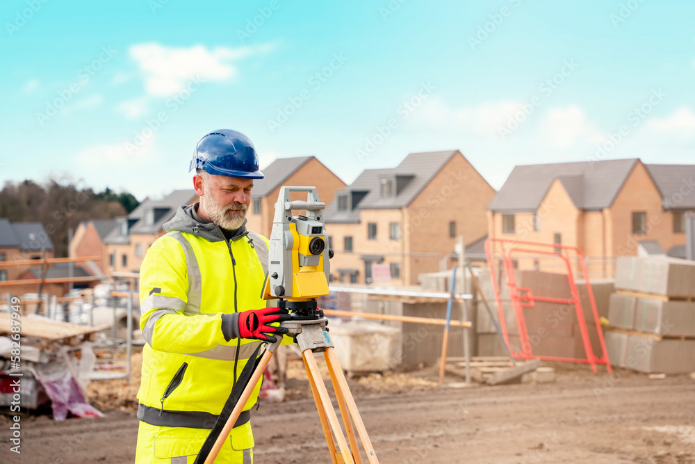 Surveyor builder site engineer with theodolite total station at ...