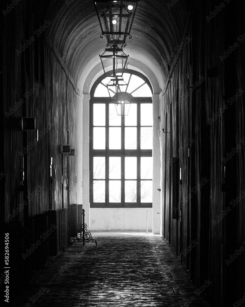 Window with dim light in a corridor of an old castle. Photography in ...