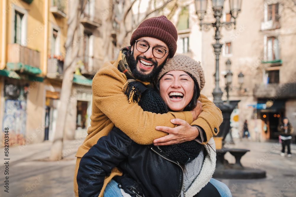 Young multiracial affectionate couple laughing and smiling together ...