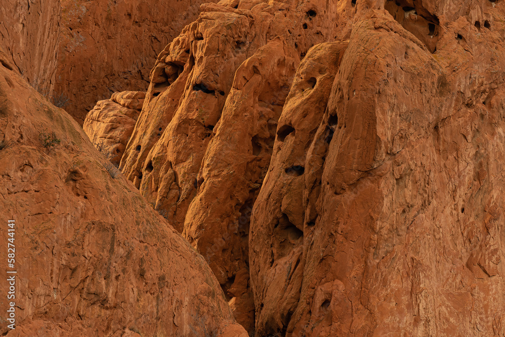 Red sandstone rock features, showing interesting texture, pits and pock ...