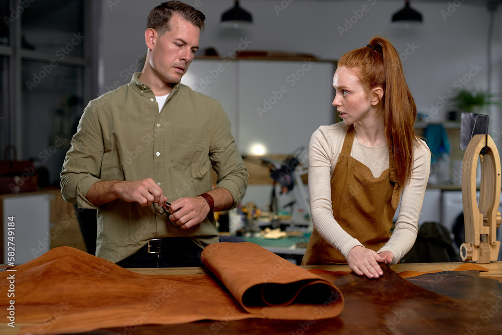 young skilled female ginger artisan oer good leather material for ...