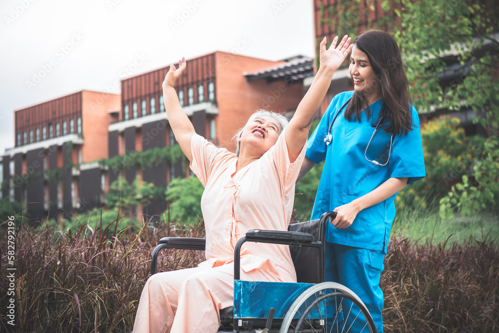 Portrait images of elderly Asian woman patient sitting on a wheelchair ...