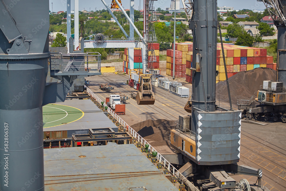 Operations with coal in seaport. Loading coal on bulk carrier. Coal ...