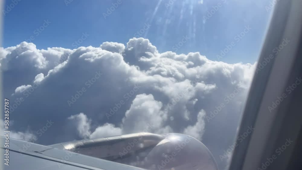 Passenger aircraft porthole view to the plane wing, jet engine and ...