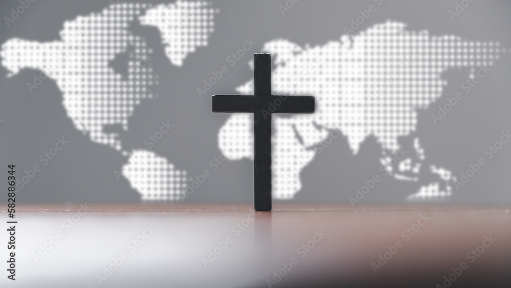 Jesus christ cross on wooden table with world map blur background. Idea ...
