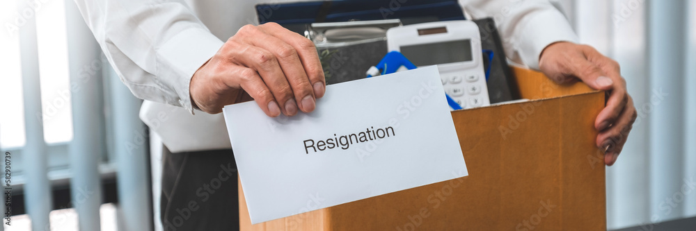Business man stressing with resignation letter for quit a job packing ...