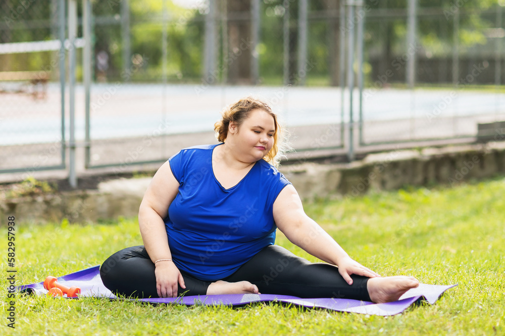 Young plus size blonde woman leading a healthy lifestyle doing ...