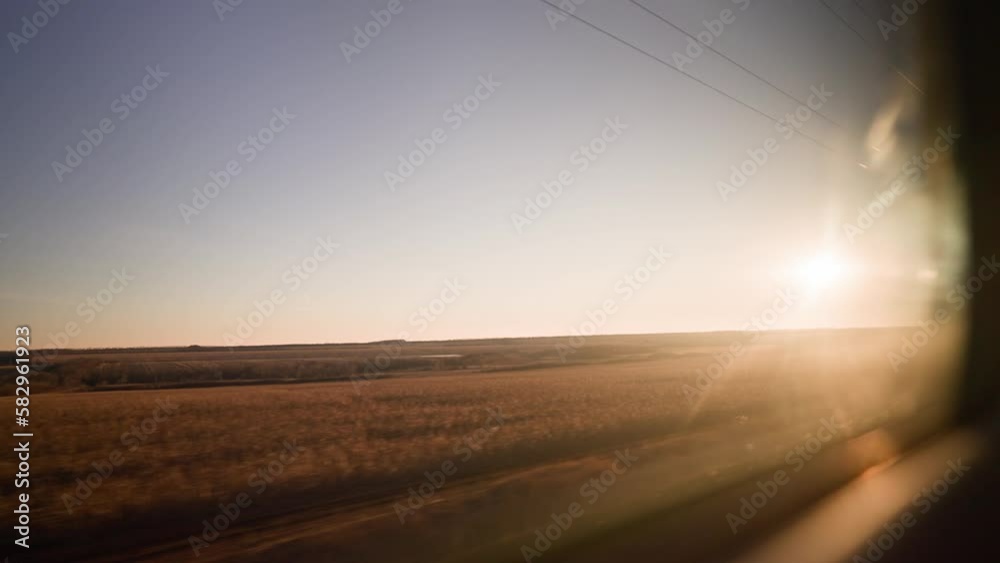 Bullet train rides on the railway track during a beautiful sunset ...