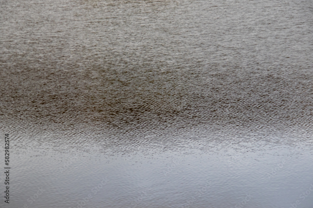 Cat'spaw ripple on the surface of water caused by a light breeze Stock ...