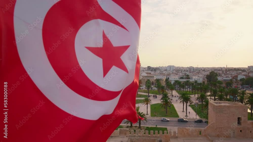 Flag and Ribat of Monastir to the city landscape. Mausoleum of Habib ...