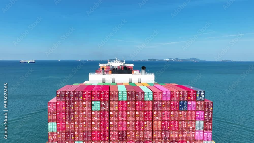 Stern of cargo ship carrying container and running for import goods ...