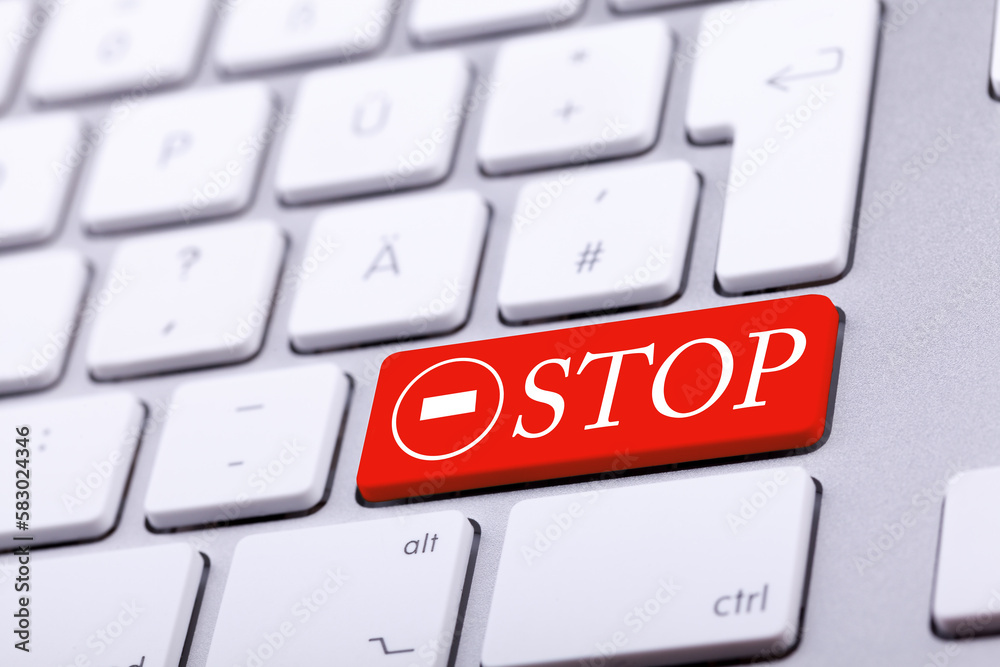 Aluminium keyboard with STOP word and sign in red. Studio photo ...