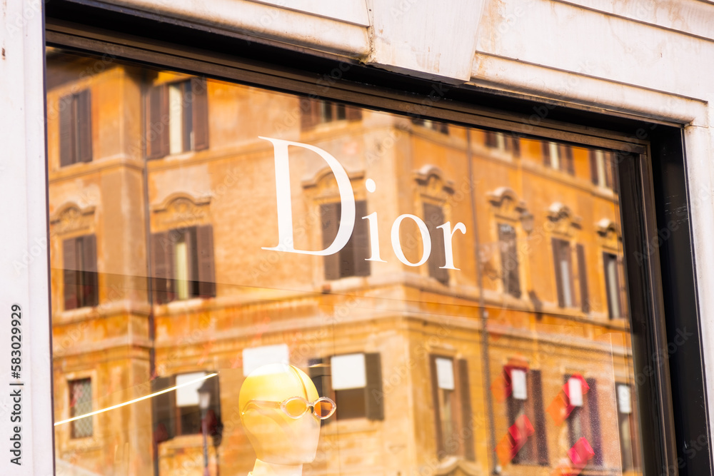 Amazing Dior store window with a reflection of house in Rome. Fashion ...