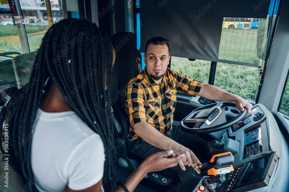 Bus driver behind the wheel of a public transport vehicle Stock Photo ...