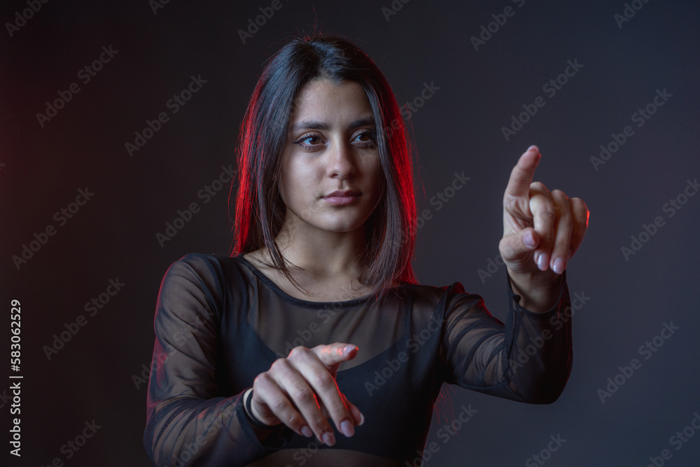 Portrait of beautiful cyber model woman posing wearing black leather ...