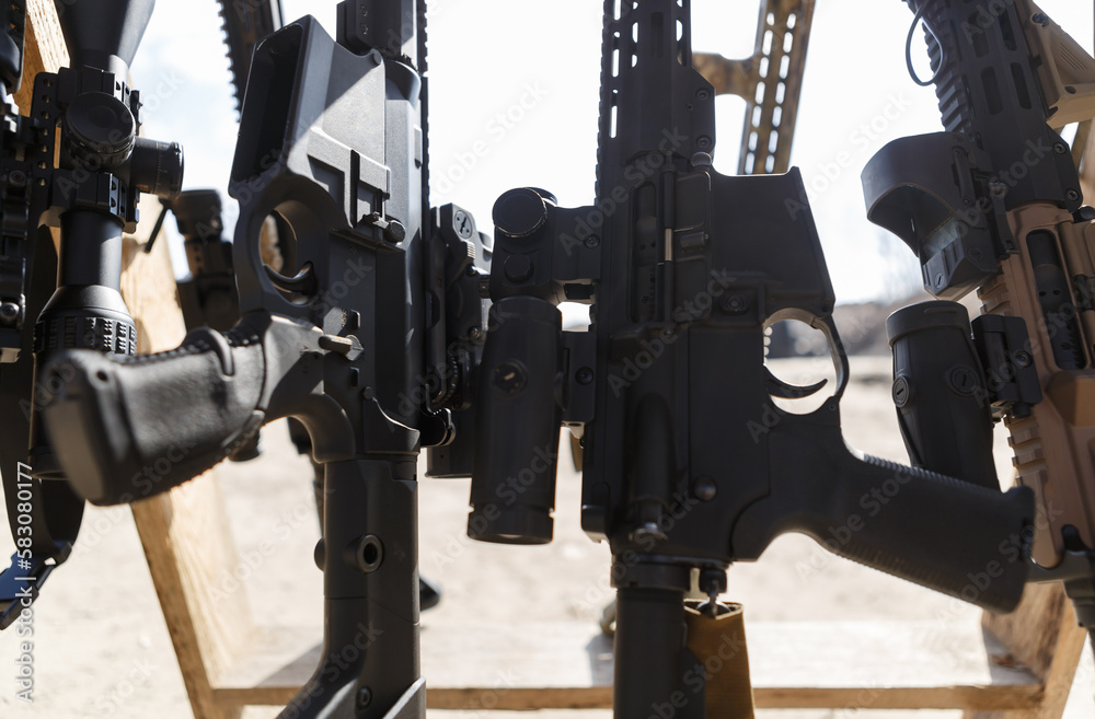 Modern American assault rifles equipped with optical scopes and ...
