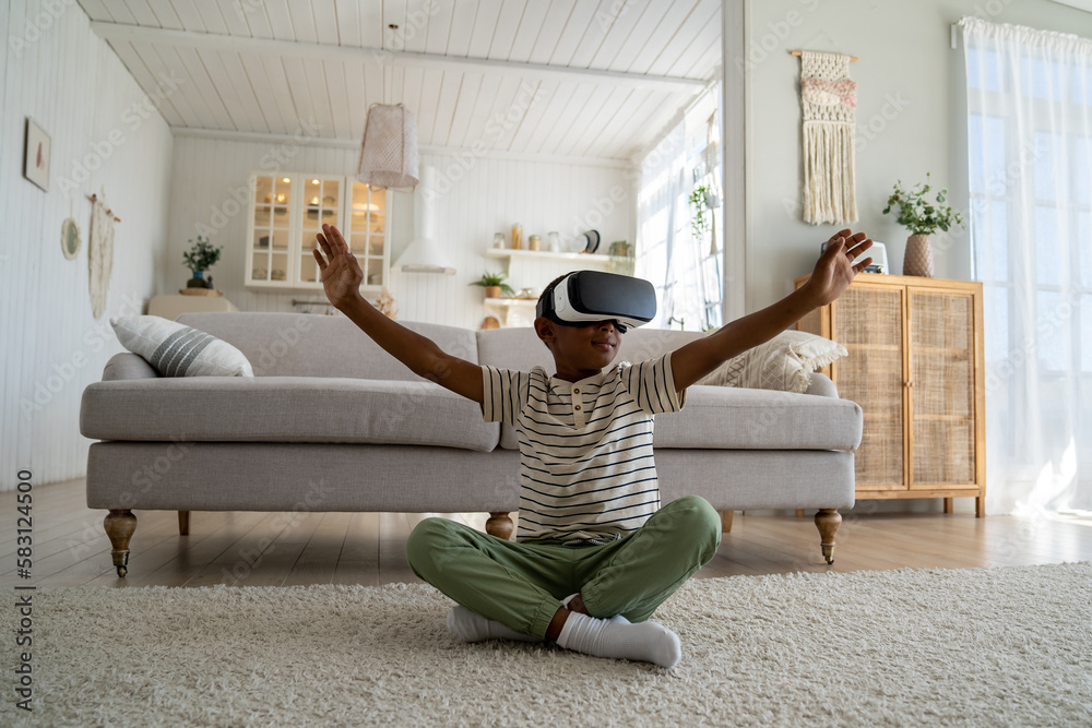 Digital child. Little African American boy kid playing VR simulation ...