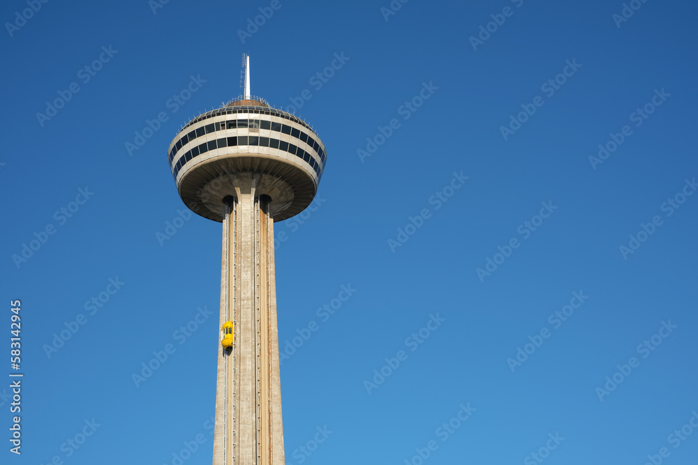Looking up at observation deck and revolving restaurant pod of the ...