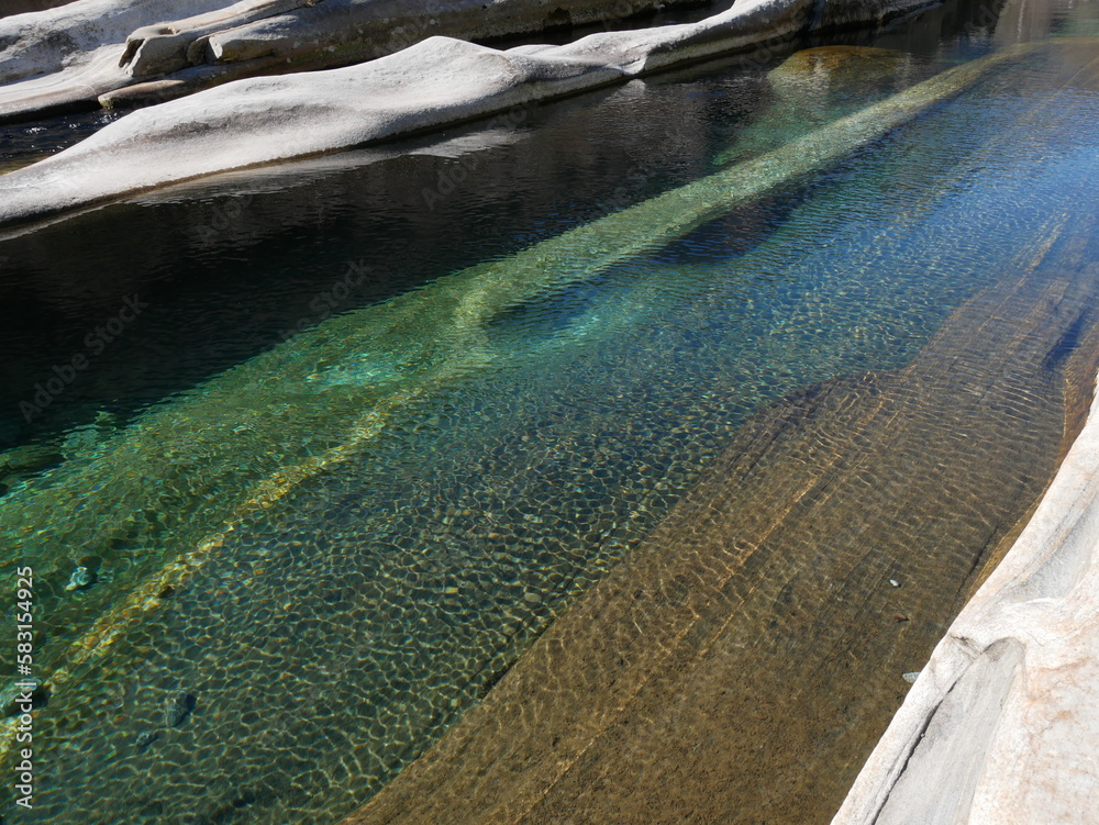 The crystalline and emerald waters in the canyons of the Verzasca river ...