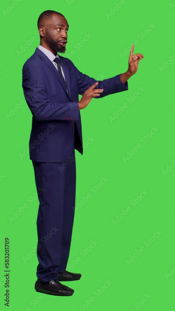 Vertical video: Profile of negative businessman doing stop sign with ...