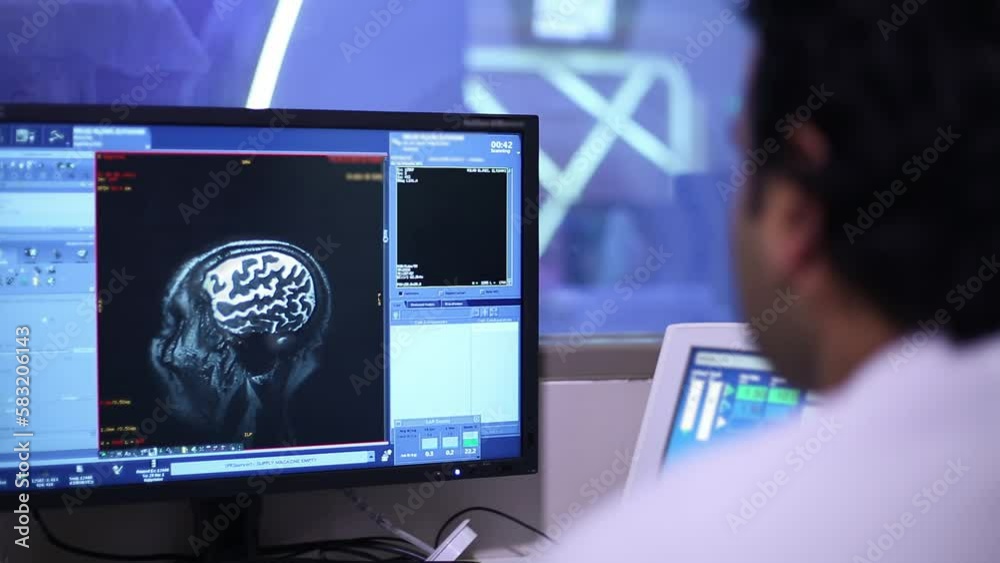 Computed tomography of the brain. The doctor examines the result of the ...