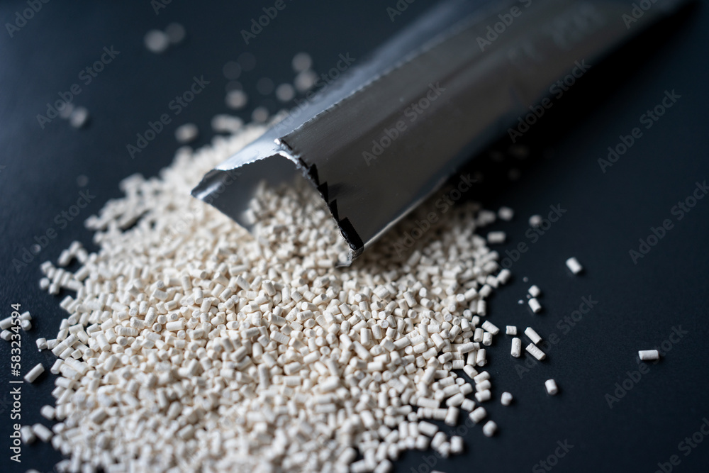 granules of the drug on a black background, granules, medication ...