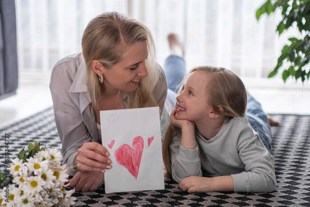 daughter congratulate her mother by handmade postcard and flowers for ...