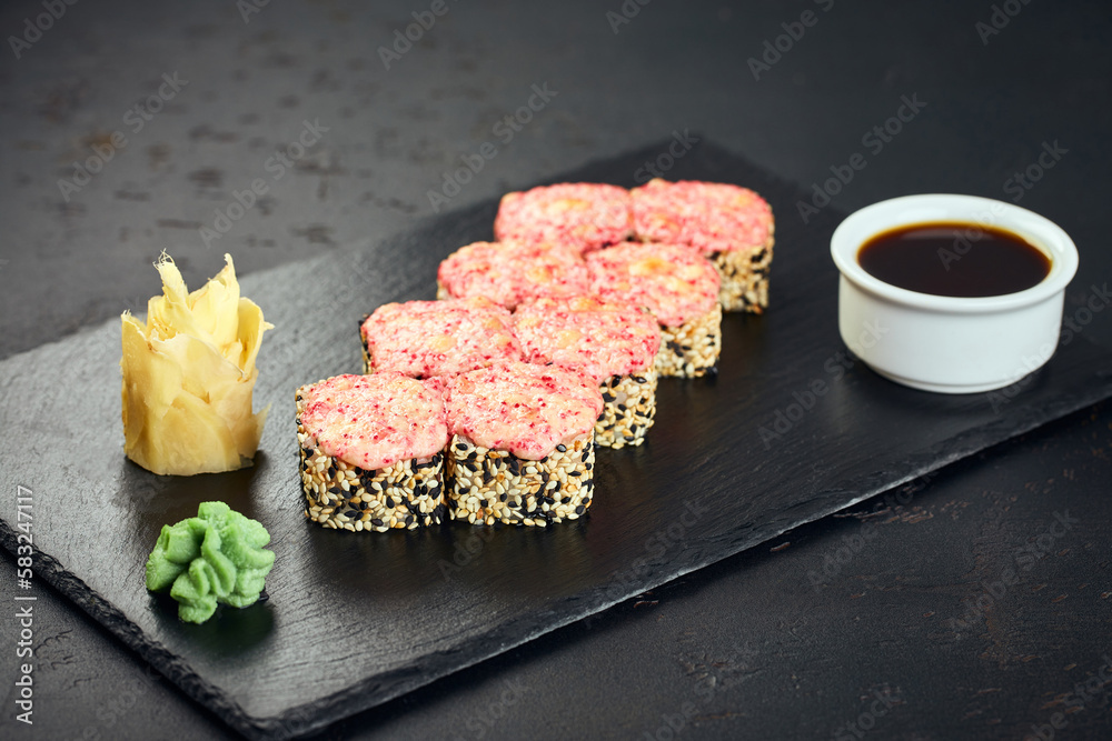 Baked rolls with sesame seeds and cap of crab, cream cheese and tobiko ...