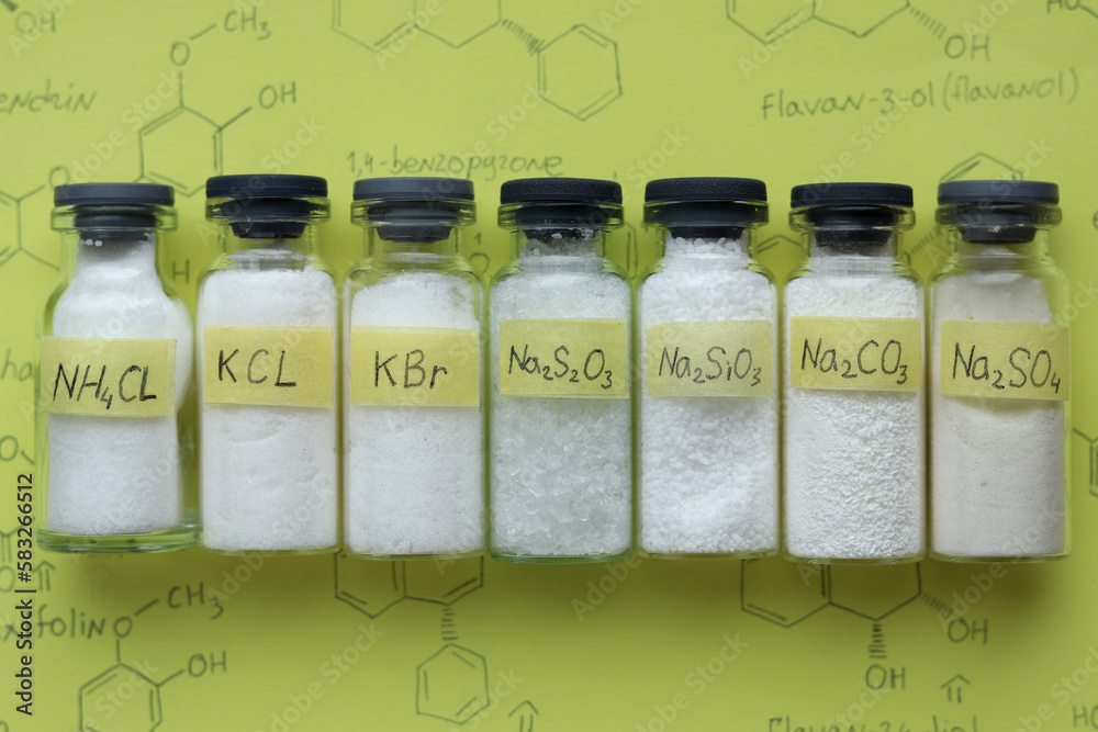 White inorganic reagents in glass bottles: ammonium chloride, potassium ...