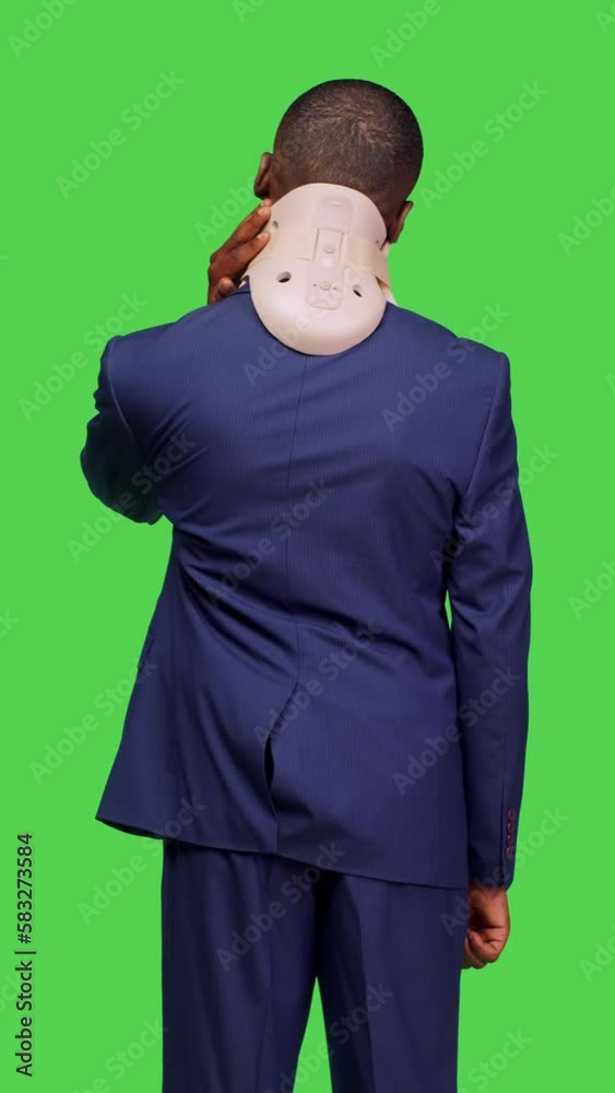 Vertical video: Back view of young adult with fracture using cervical ...