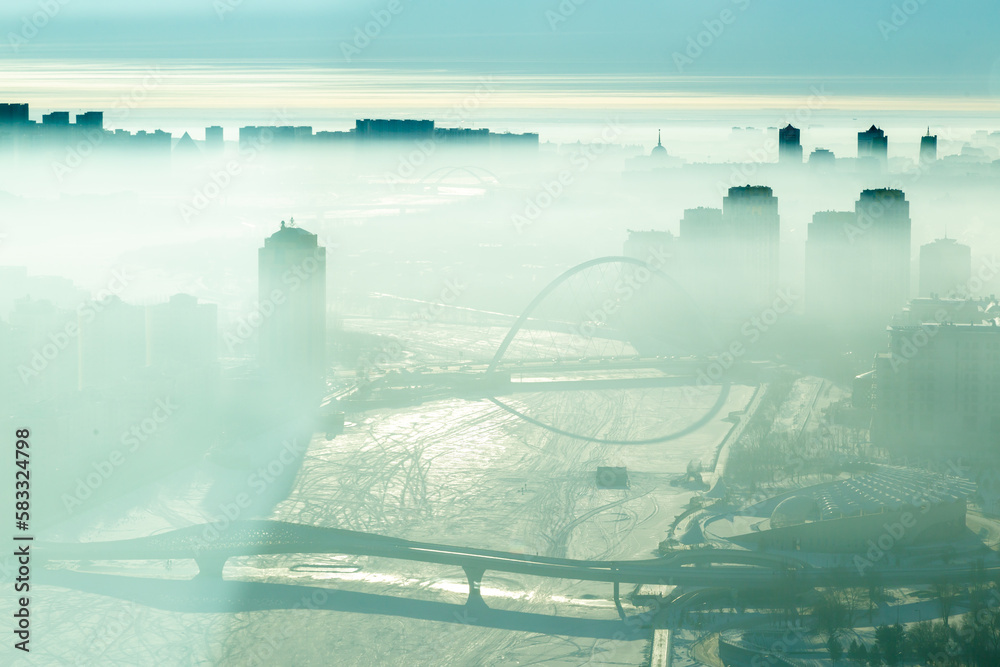 The fog and clouds create an ethereal ambiance as Astana's bird's-eye ...