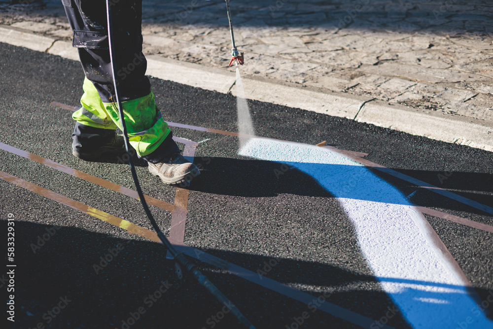 Process of making new road surface markings with a line striping ...