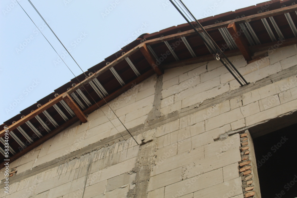 house building in the process of construction with white brick walls ...