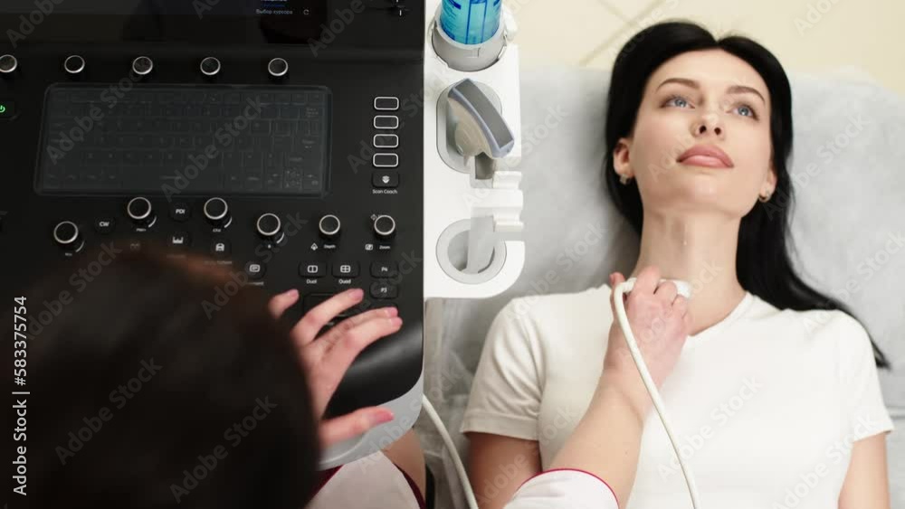 The doctor's hand conducts a medical examination of the patient using ...