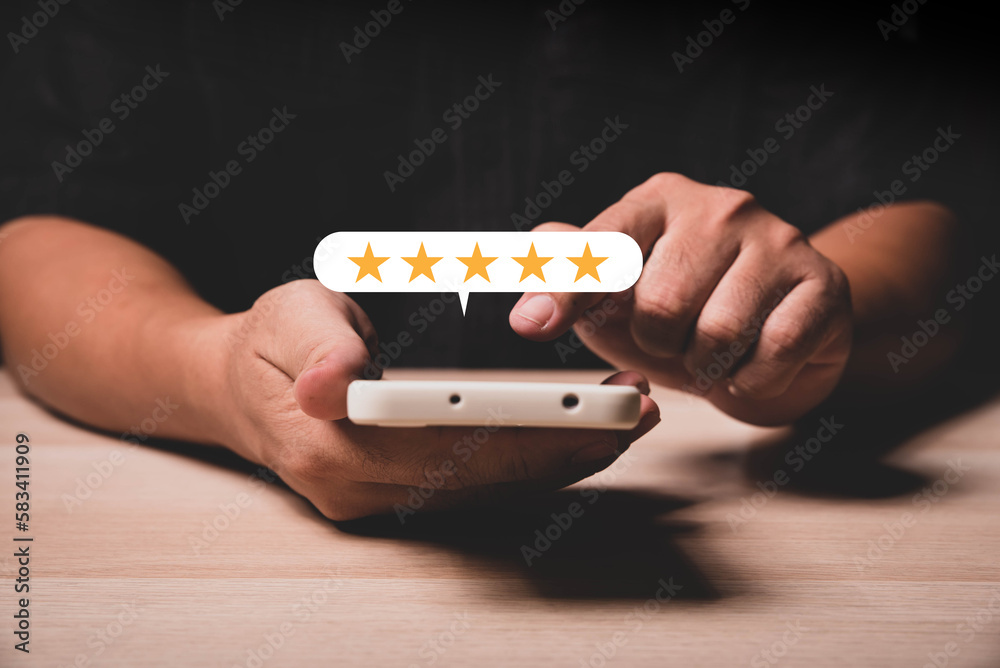 men using smartphone to give positive review for client's satisfaction surveys. giving a five ...