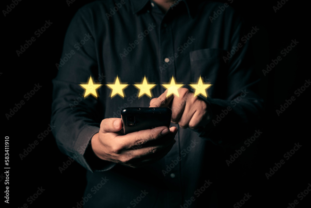 men using smartphone to give positive review for client's satisfaction surveys. giving a five ...