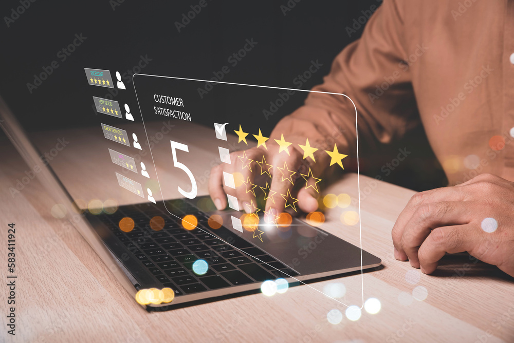 men using laptop to give positive review for client's satisfaction surveys. giving a five star ...