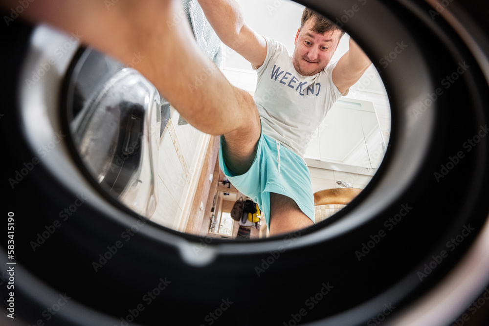 Man view from washing machine inside. Male does daily routine. Climbs ...