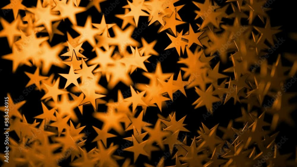 Gold star background loop. Falling gold stars with shallow focus on a black background. Loops ...