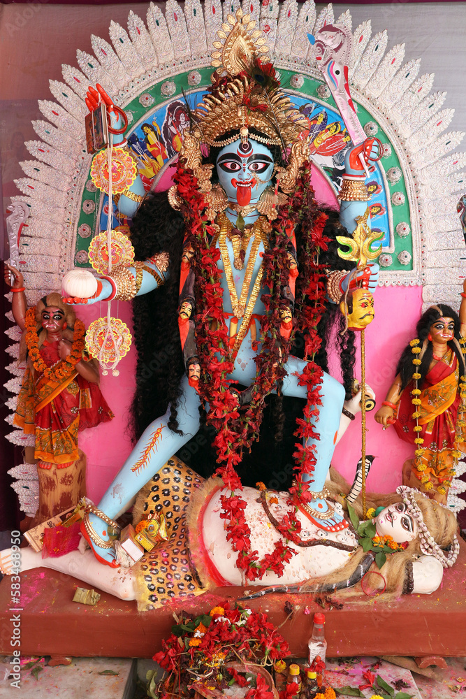 Fotka „The terrible goddess Kali with her tongue hanging out and a ...