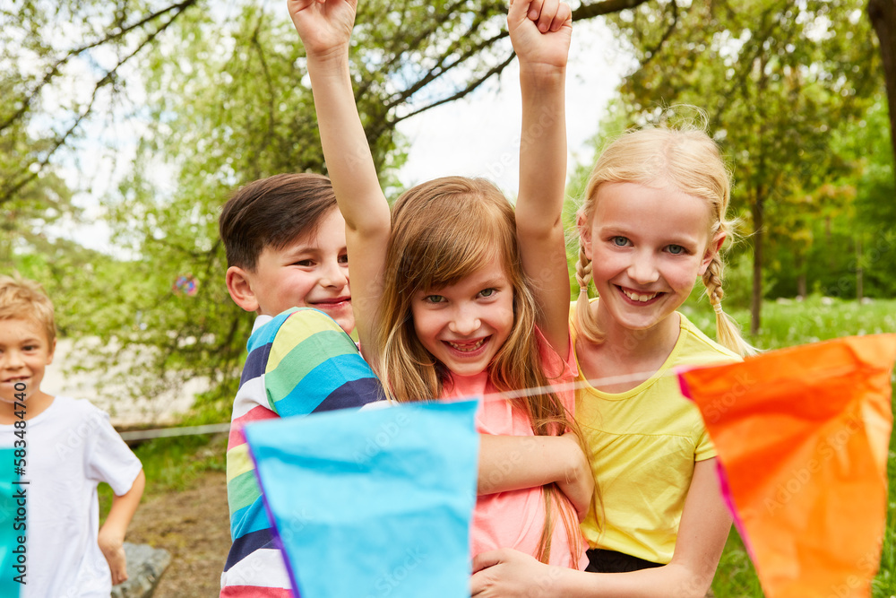 Group of children celebrating winner after running competition Stock ...