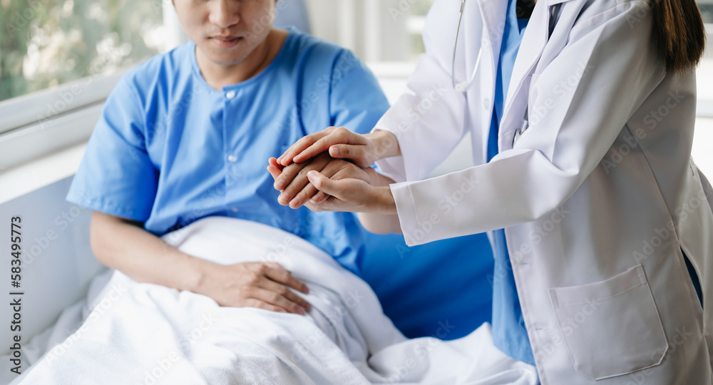 medical doctor holing patient's hands and comforting her.Kind doctor ...