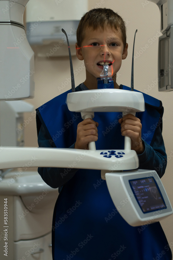 Jaw computed tomography, check up teeth in dental clinic. Little boy ...