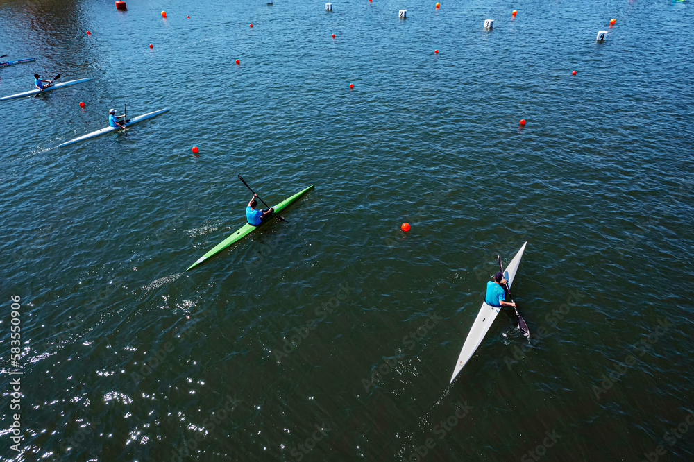 training of rowers on kayaks and canoes on rowing channel. top view ...