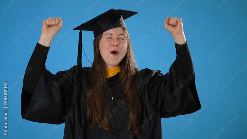 Graduate girl with diploma, shows gesture of victory and success on ...