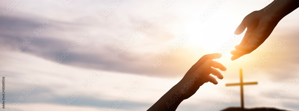 the hand of god helping and giving hope, in a background with the cross ...